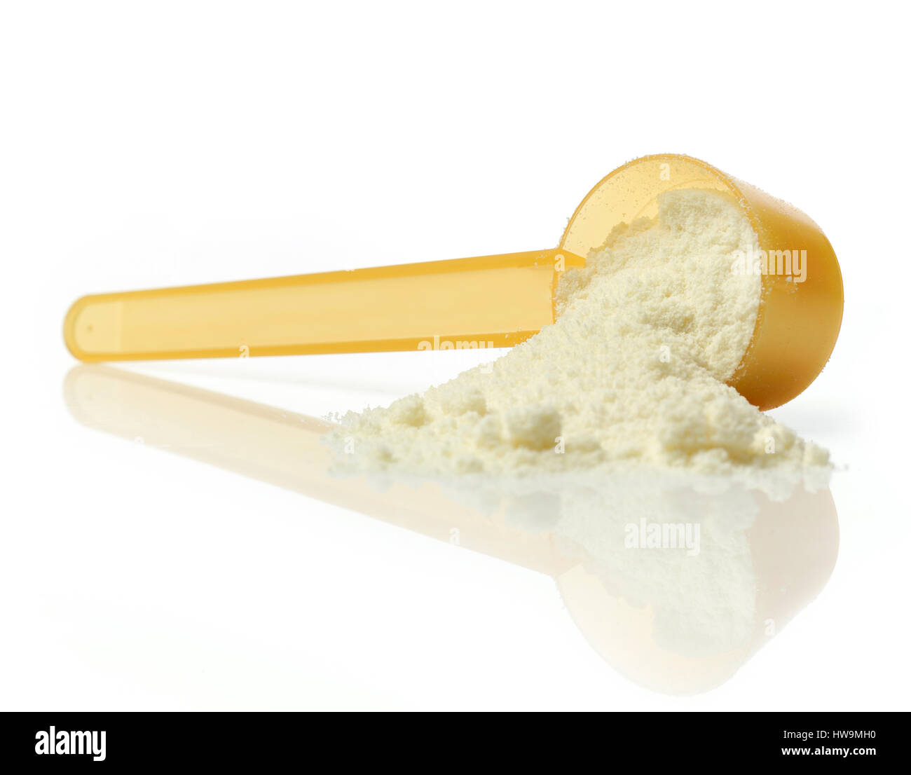 powdered milk in plastic spoon isolated on white background Stock Photo ...
