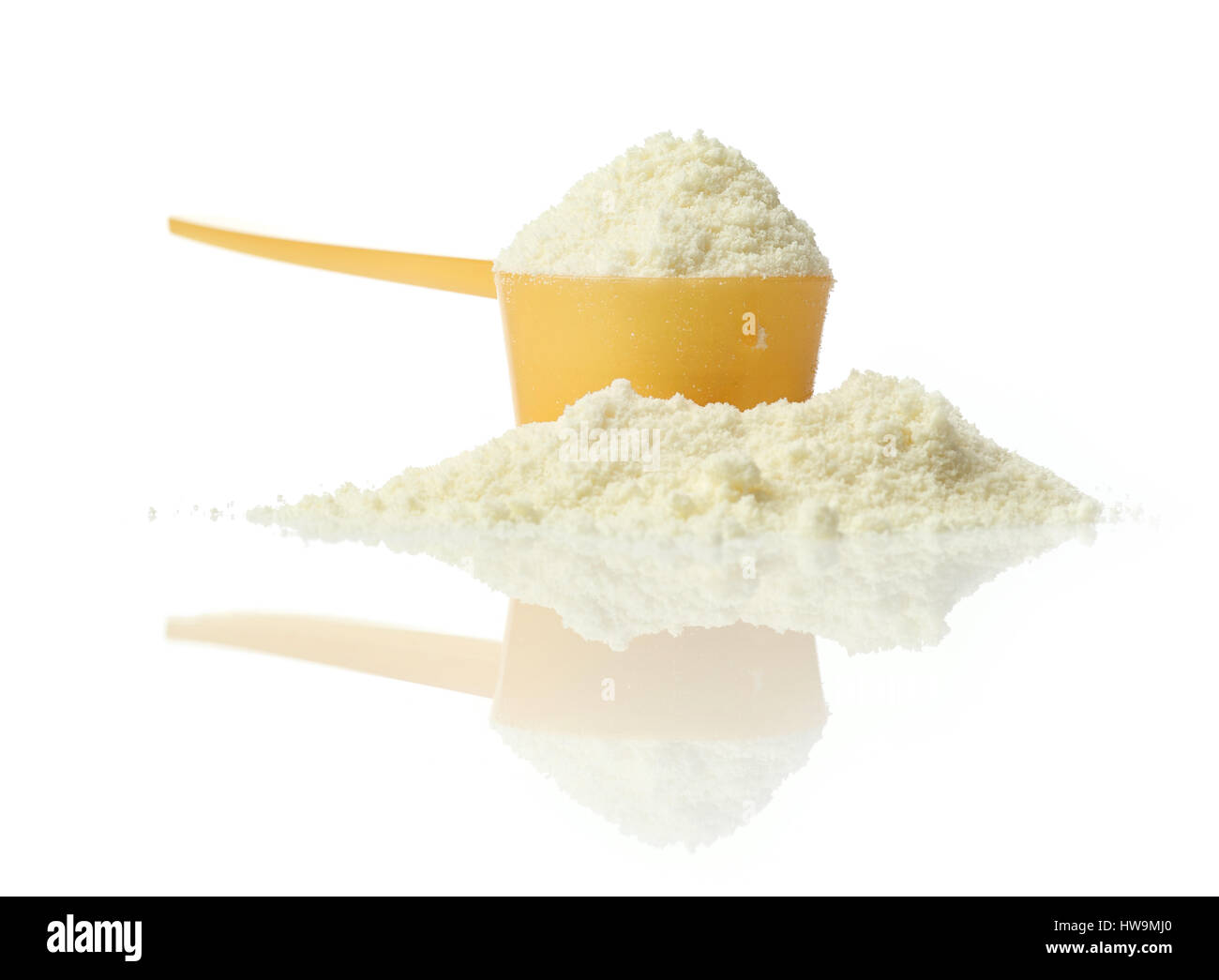 powdered milk in plastic spoon isolated on white background Stock Photo ...