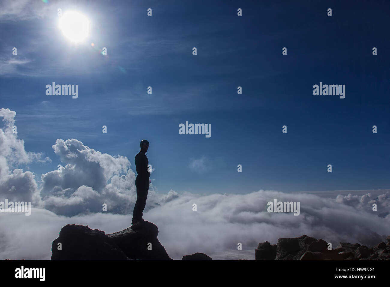 A mountain tourist looks admiring the nature before his difficult ...