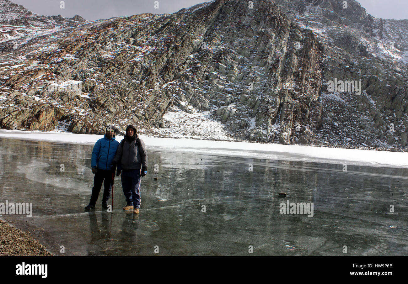 Anantnag, India. 24th Dec, 2016. A Hiker's Walks Over the frozen ...