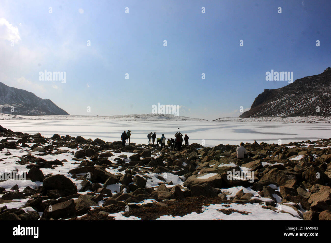 Anantnag, India. 24th Dec, 2016. Trekkers taking rest at the frozen ...