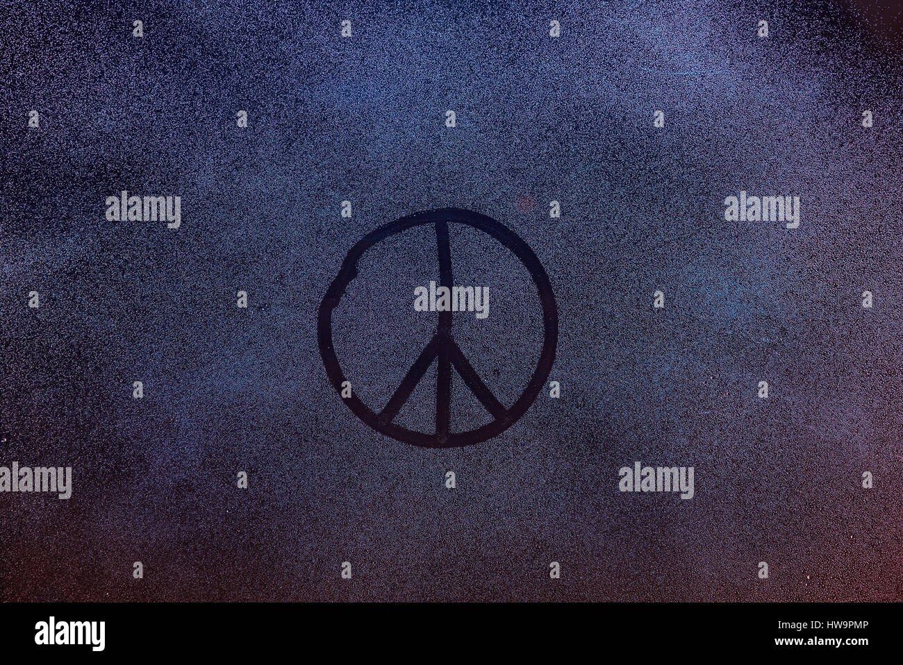 Peace sign draw on frozen window at winter night. Peace symbol on foggy ...