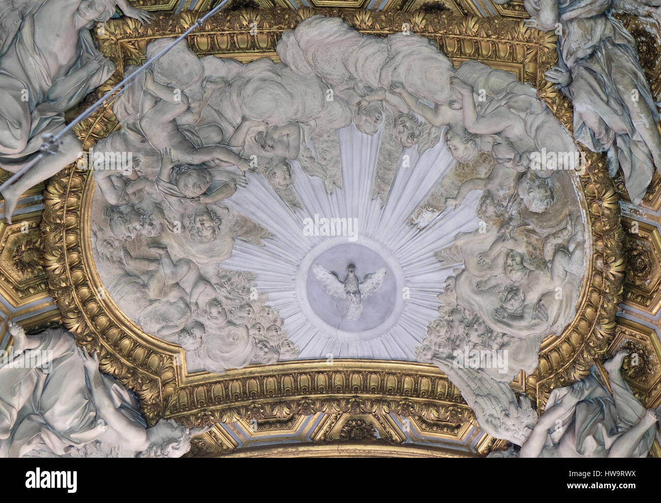 Holy spirit and angels, stucco decoration on the ceiling of chapel of ...