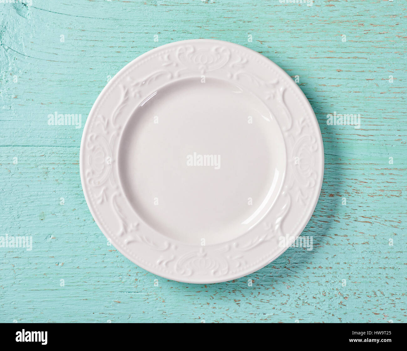 Empty plate on blue hi-res stock photography and images - Alamy