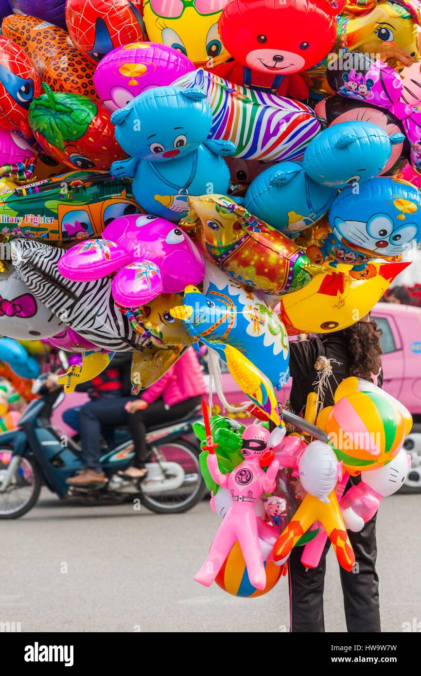 Vietnam, Haiphong, Tet Lunar New Year, balloon seller Stock Photo - Alamy
