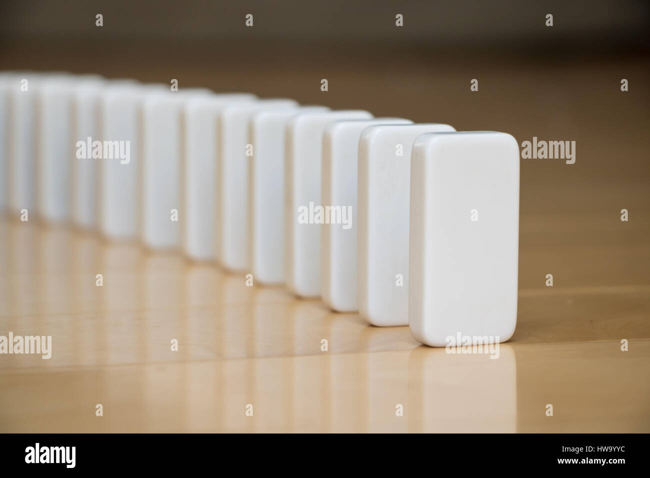 Straight Line of Blank Dominoes on Wooden Floor Stock Photo - Alamy