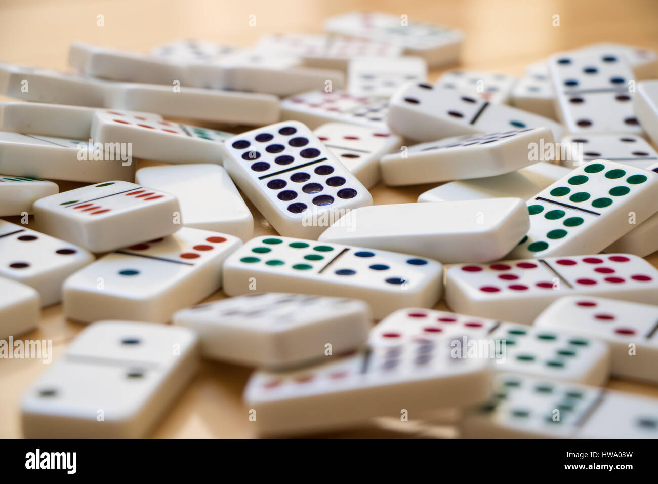 Pile of Dominoes on Wooden Floor Close Up Stock Photo - Alamy