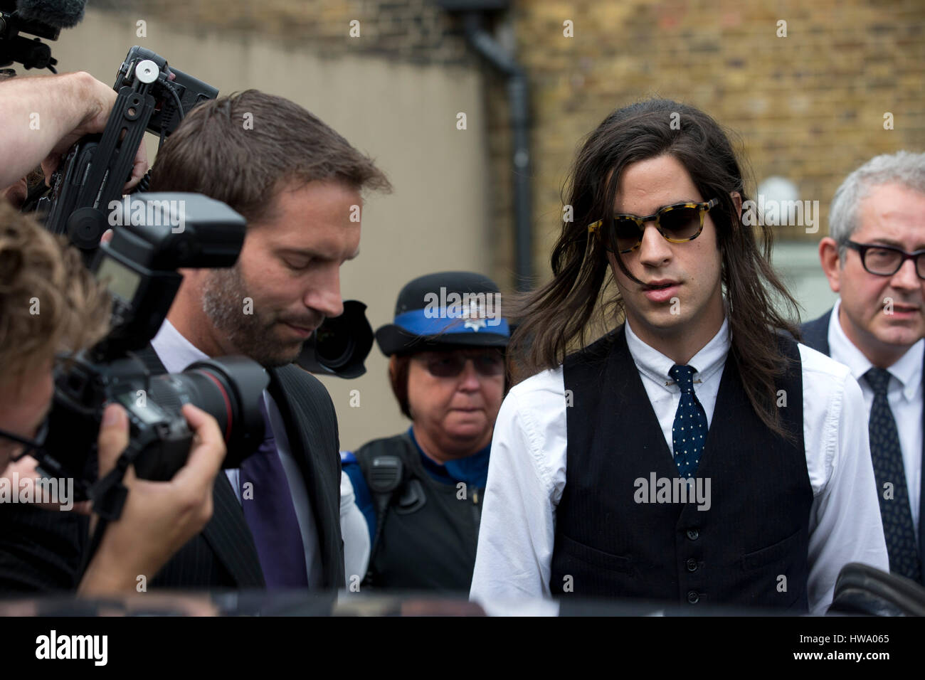 Thomas Cohen leaves after attending the inquest into the death of his ...