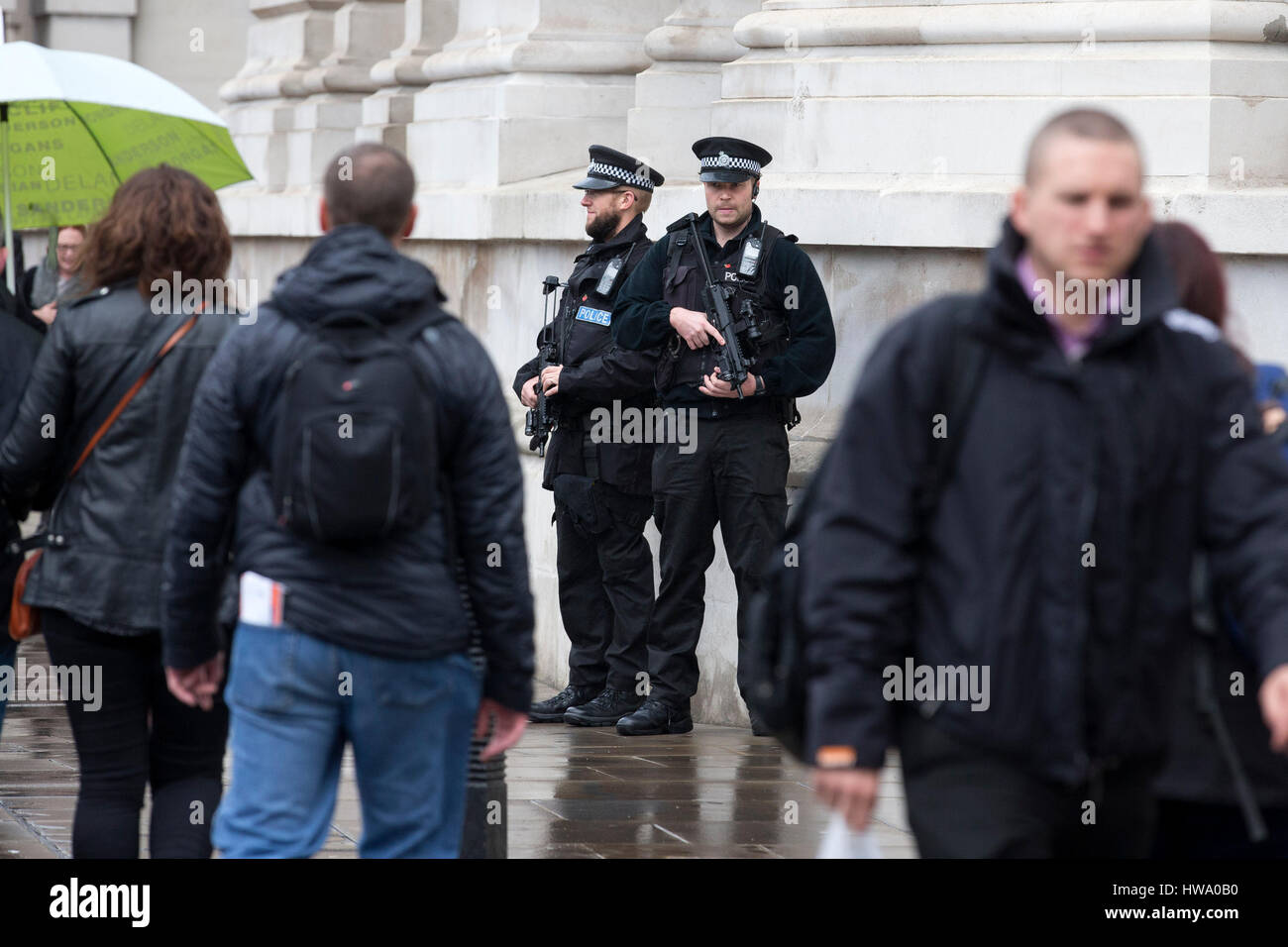 Armed police officers stand on guard in Westminster, London, UK ...