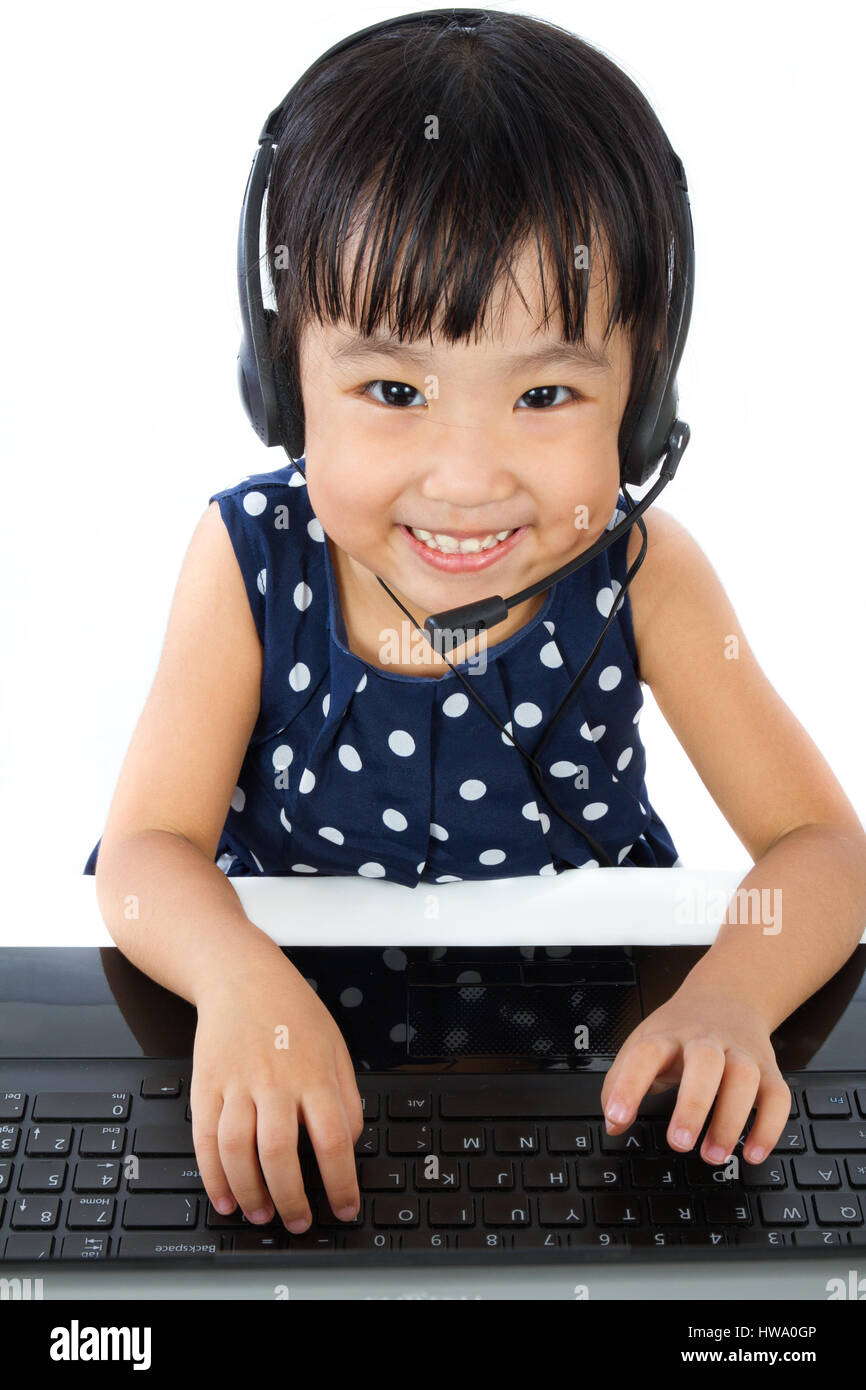 Asian Little Chinese Girl in Headset with Laptop isolated on White ...