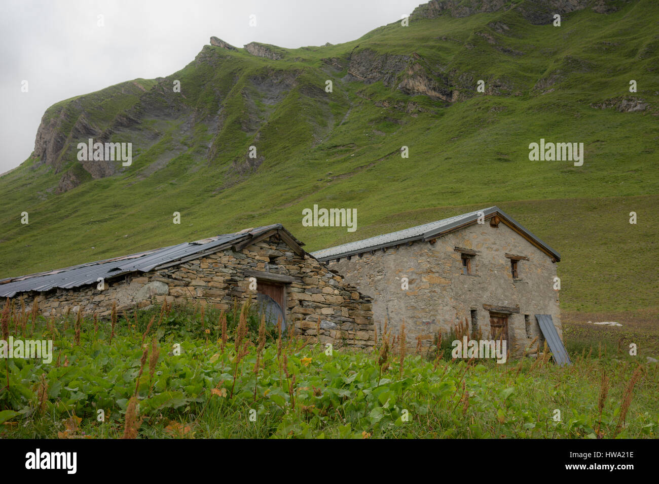 Old stone buildingS in the French alps along the Tour du Mont Blanc ...