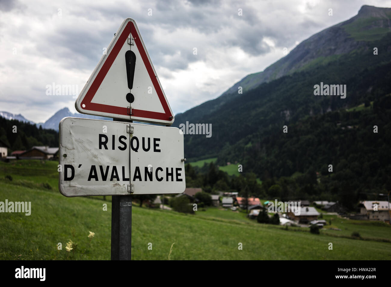 Avalanche warning sign in the French alps along the Tour du Mont Blanc ...