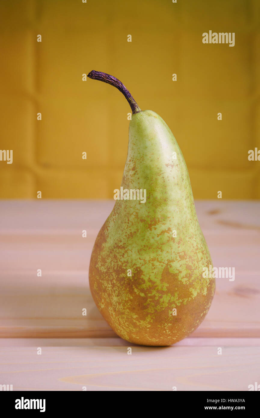 Pear green yellow close-up on a yellow background Stock Photo - Alamy