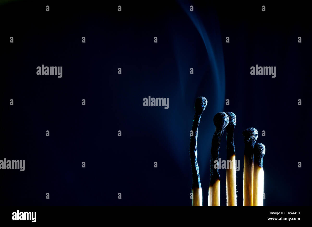 Matches on a dark background Stock Photo - Alamy