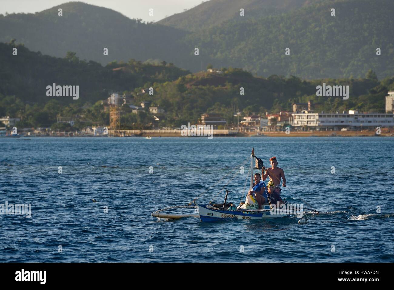 Philippines, Calamian Islands in northern Palawan, Coron bay, outrigger ...