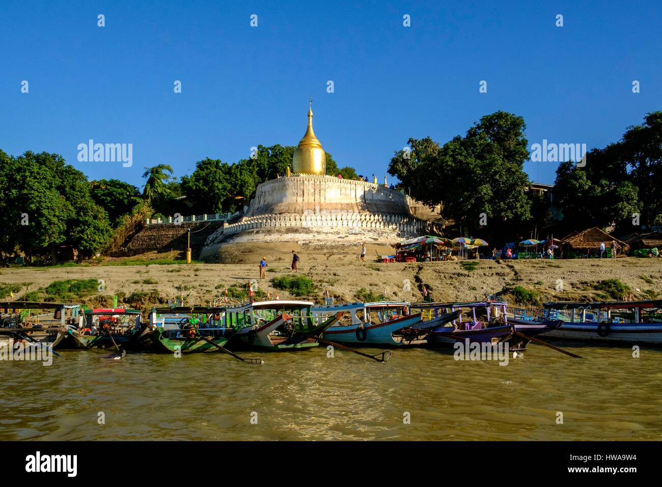 Myanmar, Bagan, monk in front of the temple of Bupaya and in background ...