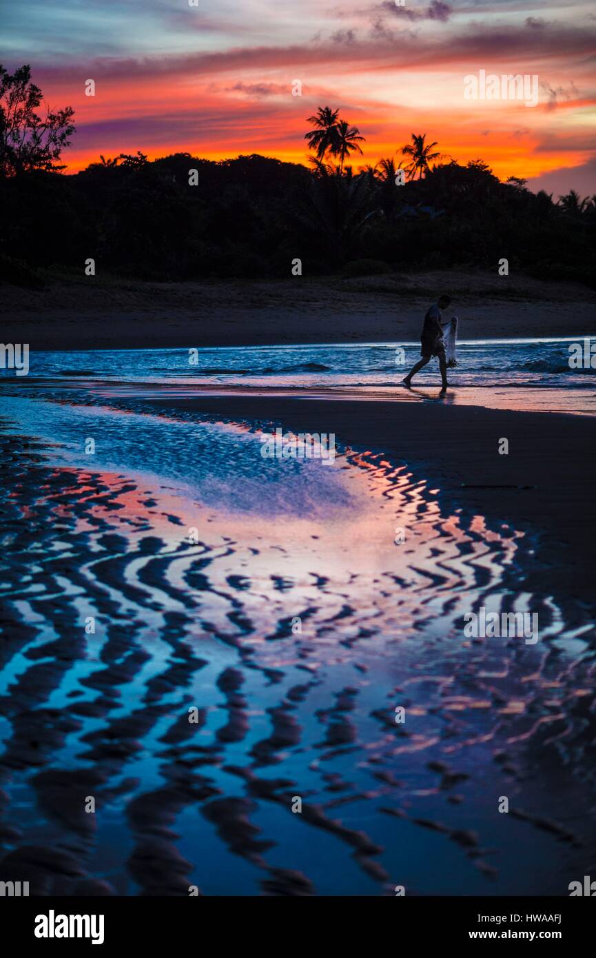 France, Guiana, Cayenne, Rémire-Montjoly beach, fisherman with ...