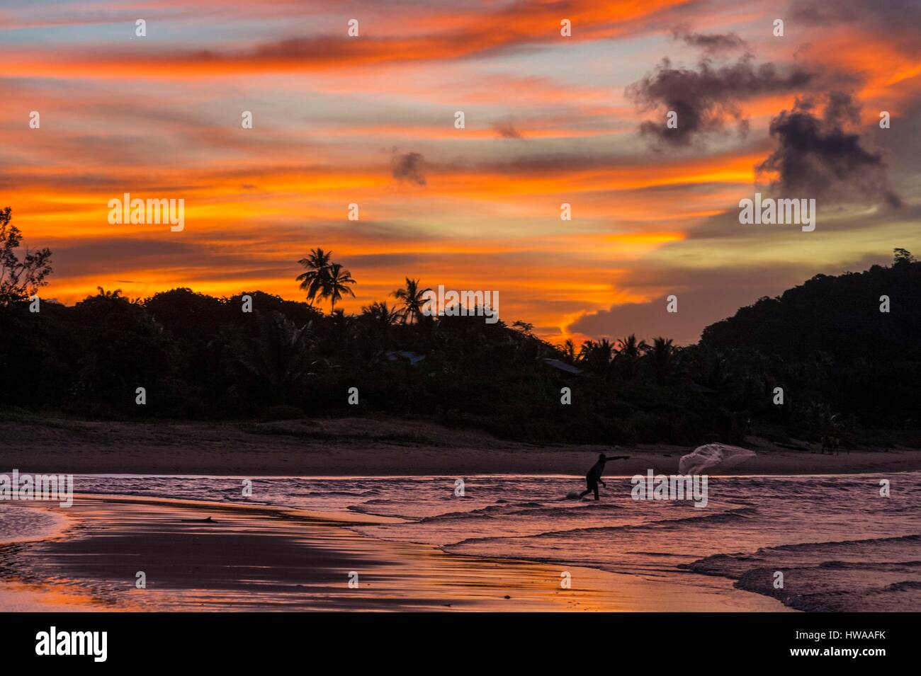 France, Guiana, Cayenne, Rémire-Montjoly beach, fisherman with ...