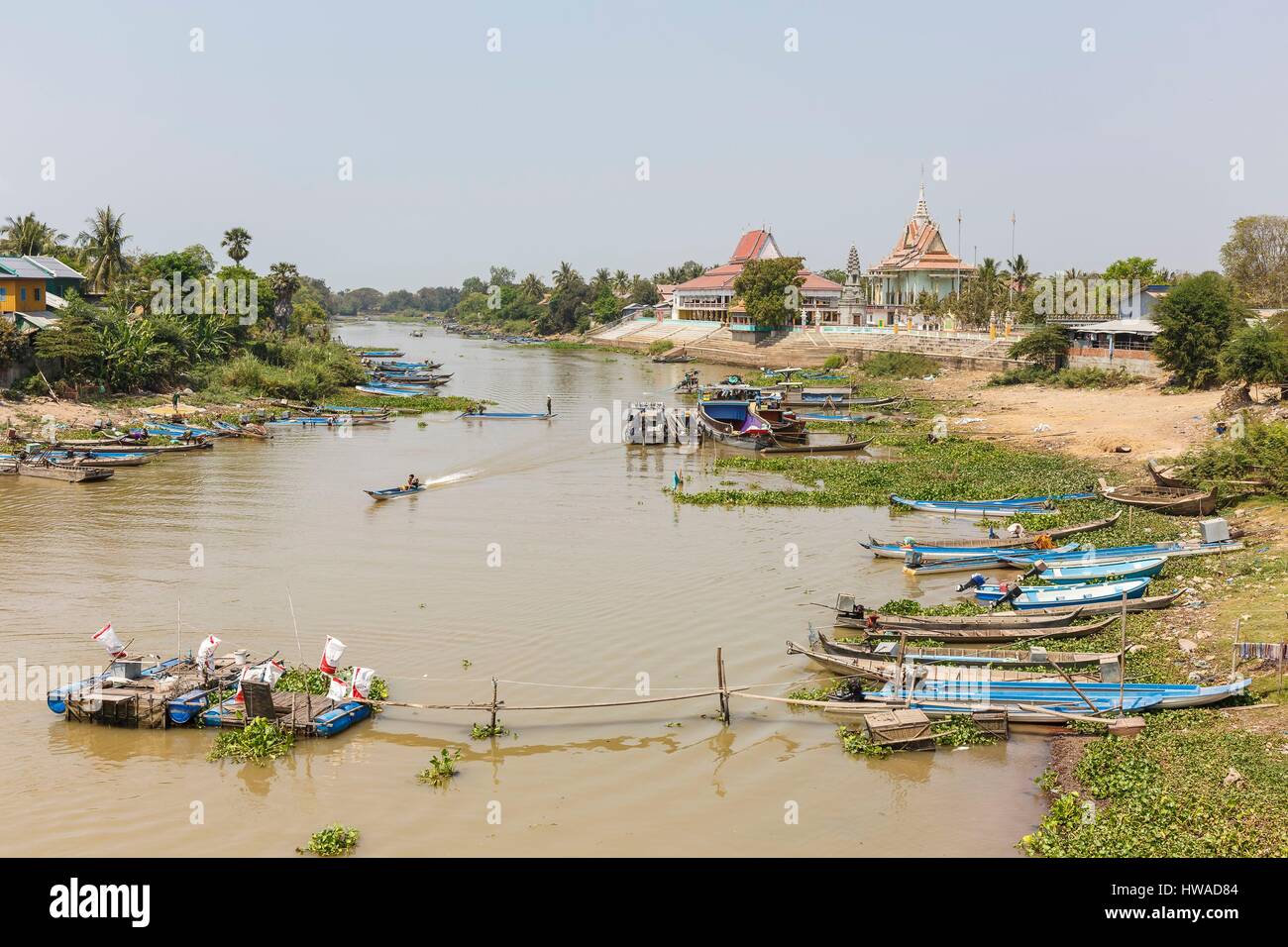 Cambodia, Takeo province, Angkor Borei, temple and boats on the river ...