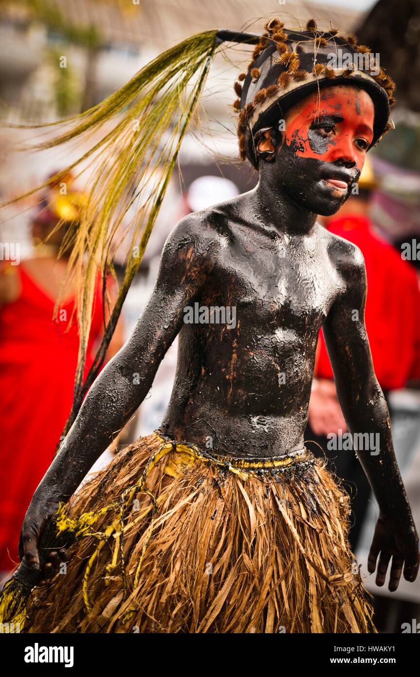 France, Guadeloupe, Basse-Terre, portrait of a young boy with battery ...