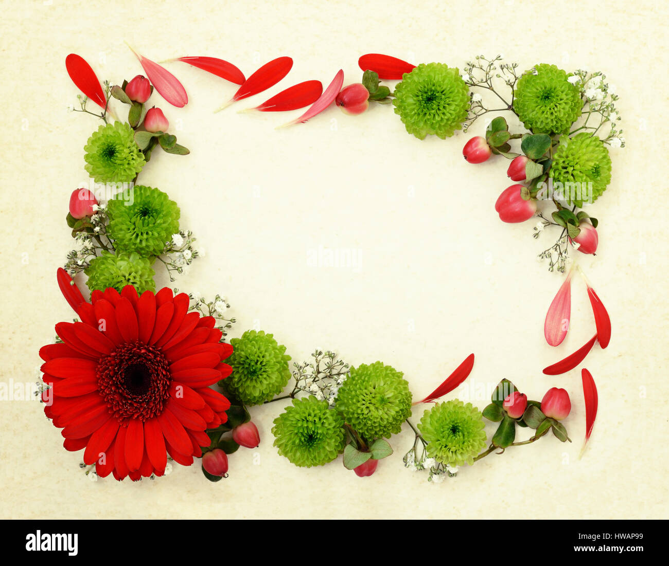 Decorative frame of red, green and white flowers on old paper ...