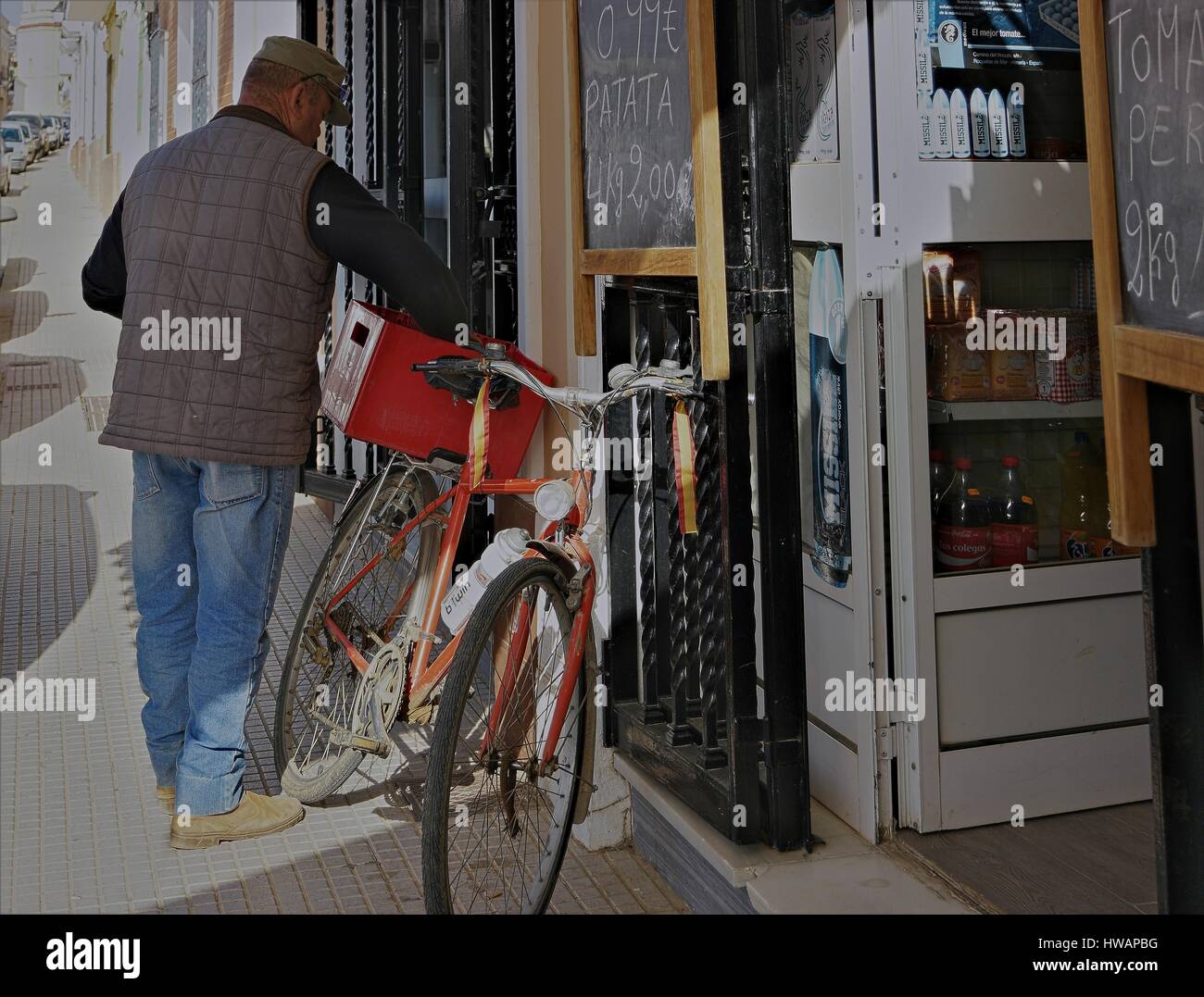 Bicycle at the door of a store Stock Photo - Alamy