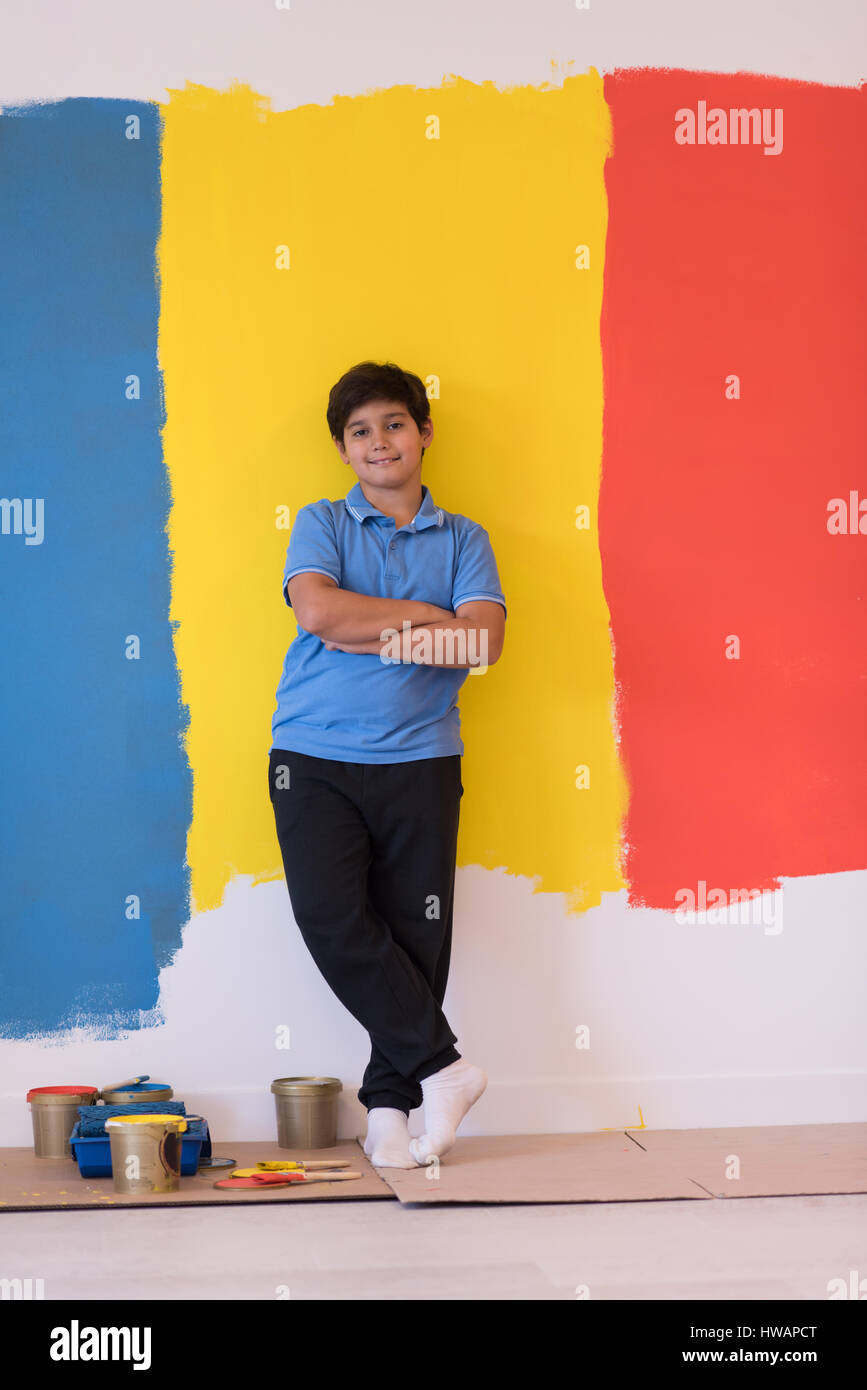 Portrait of a happy young boy in front of colored background Stock ...