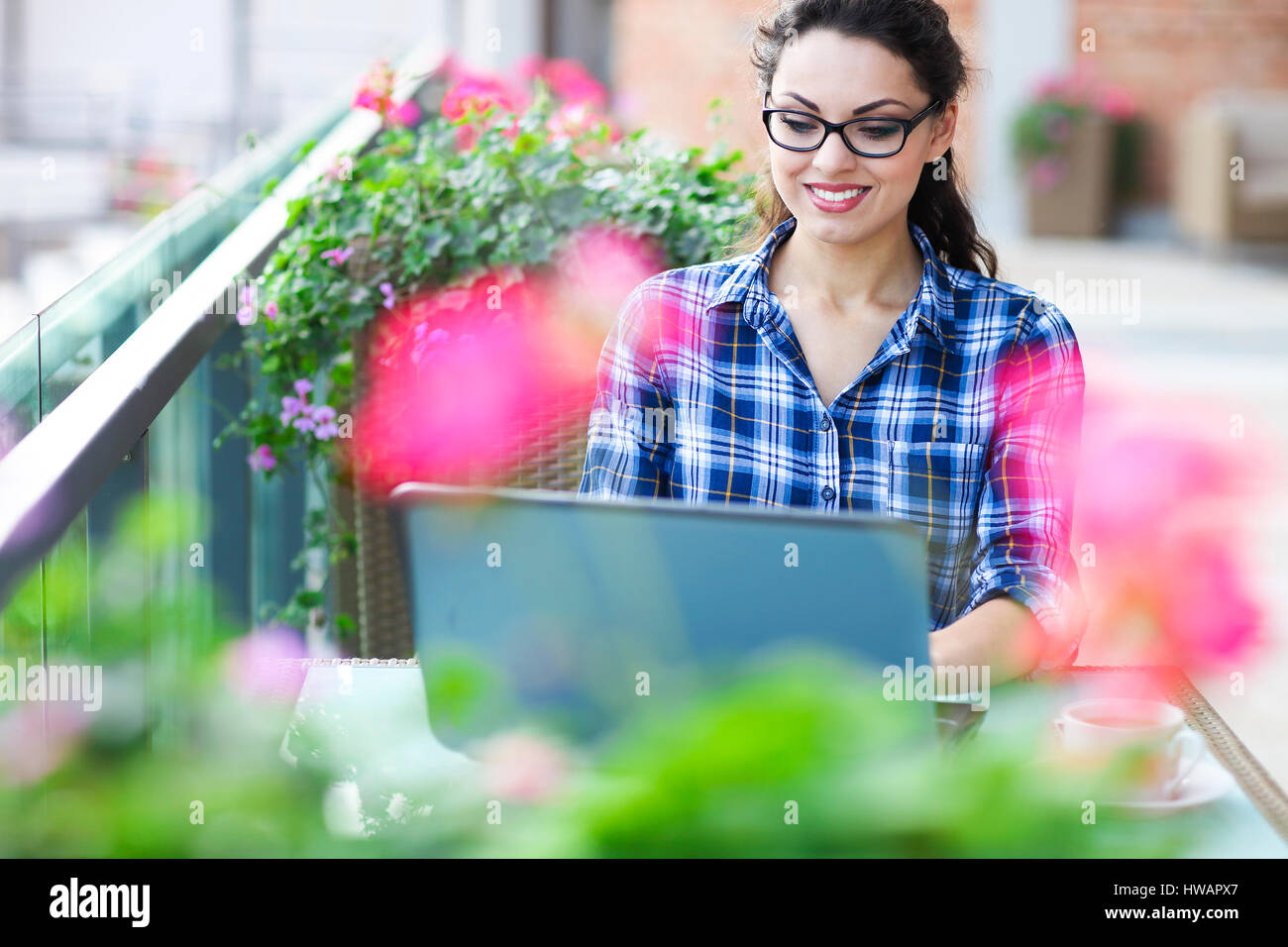 Beautiful young freelancer woman using laptop computer sitting at cafe ...