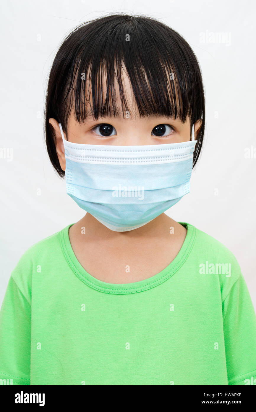 Asian Little Chinese Girl Wearing a Protective Mask in Isolated White ...