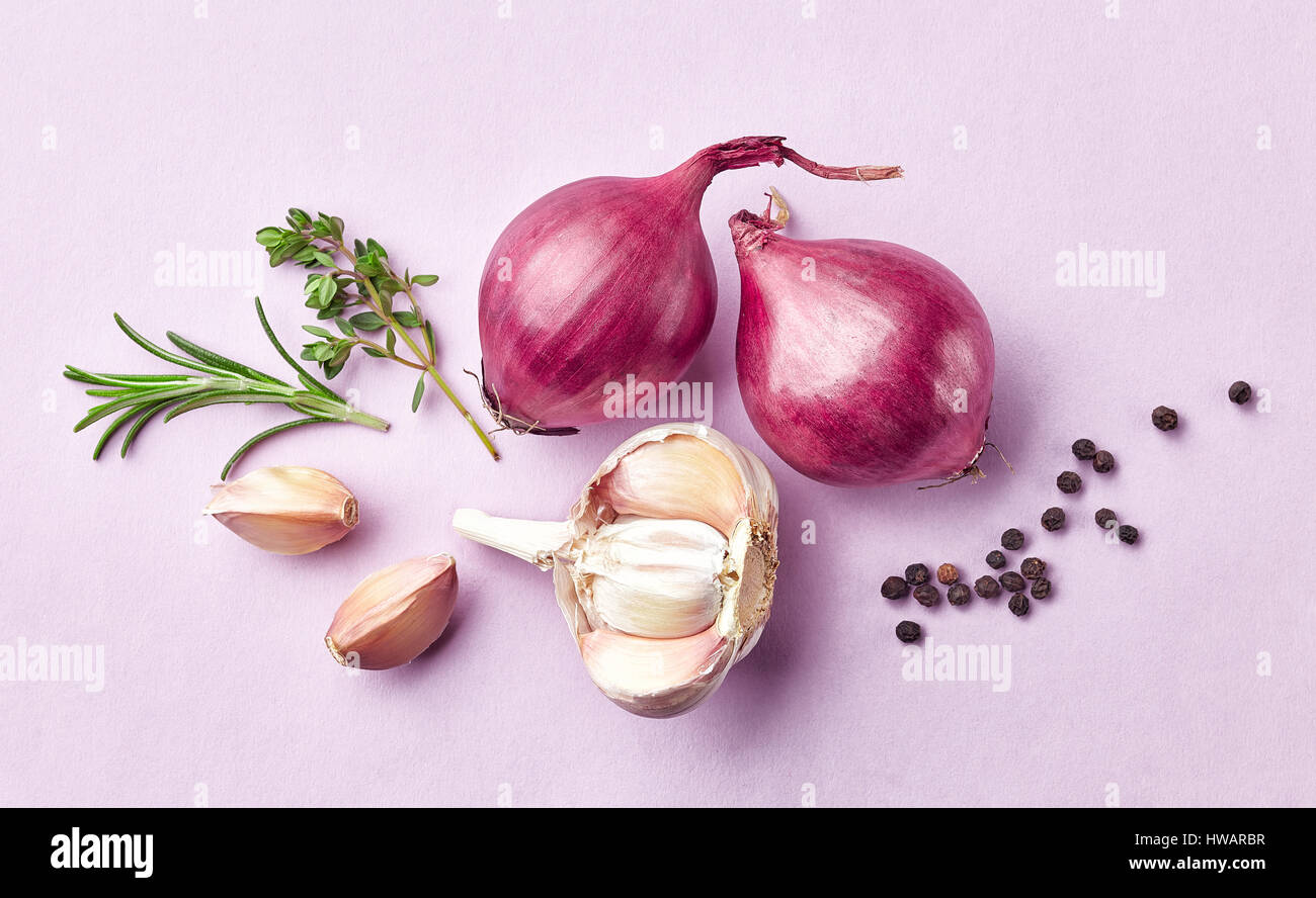 composition of red onions and spices on purple background, top view ...