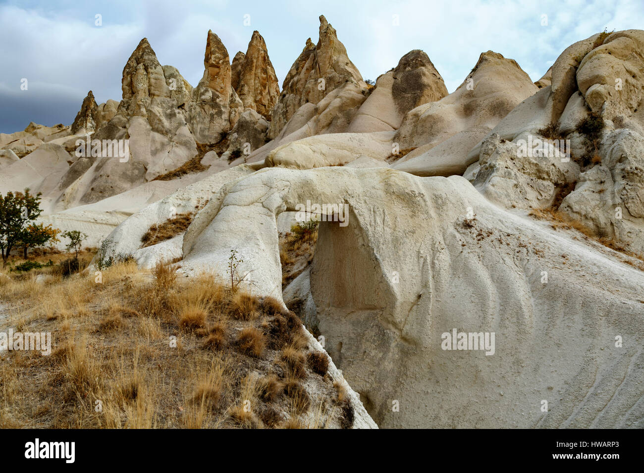 Fairy chimneys and tunnel over irrigation ditch, Love Valley ...