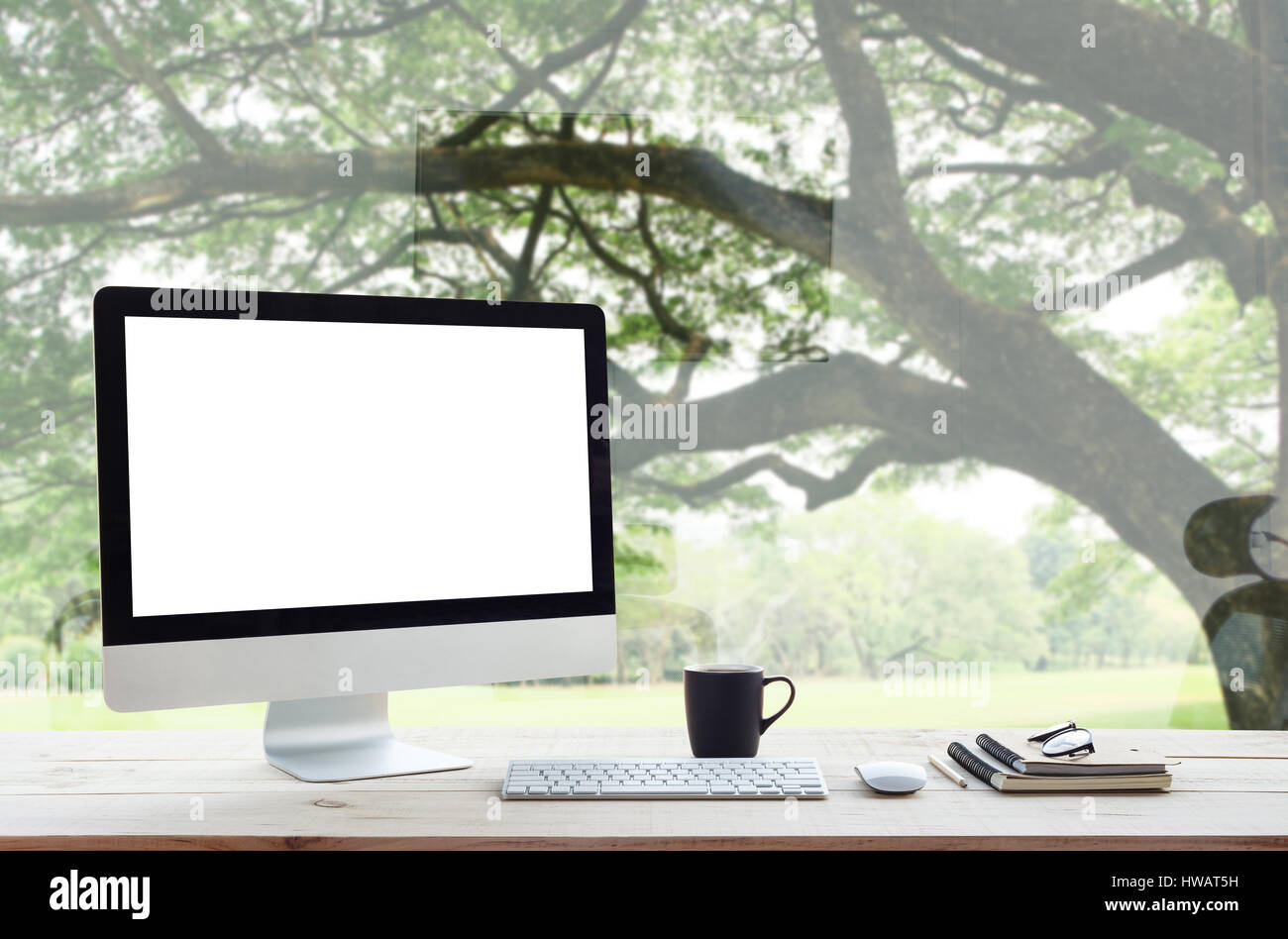 desktop computer on work table and nature background Stock Photo - Alamy