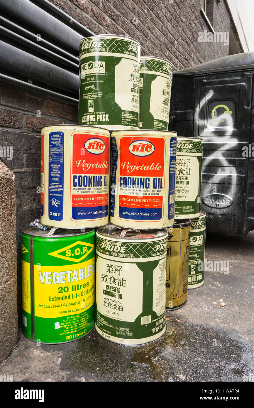 Leaking and empty drums of KTC vegetable cooking oil on a pavement in ...