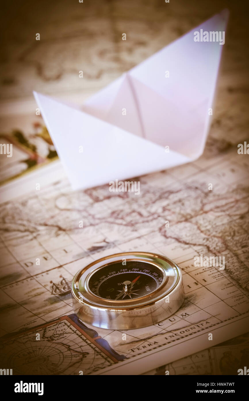 Paper boat on ancient map Stock Photo - Alamy
