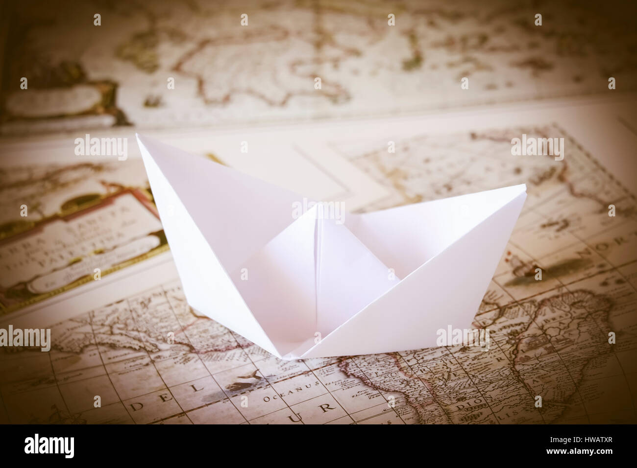 Paper boat on ancient map Stock Photo - Alamy