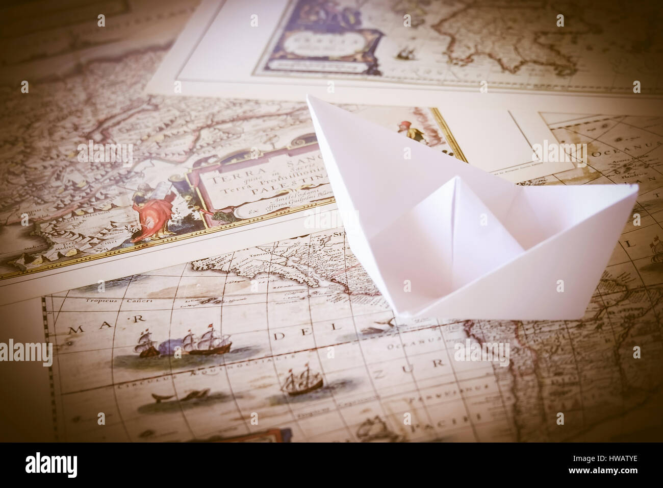 Paper boat on ancient map Stock Photo - Alamy