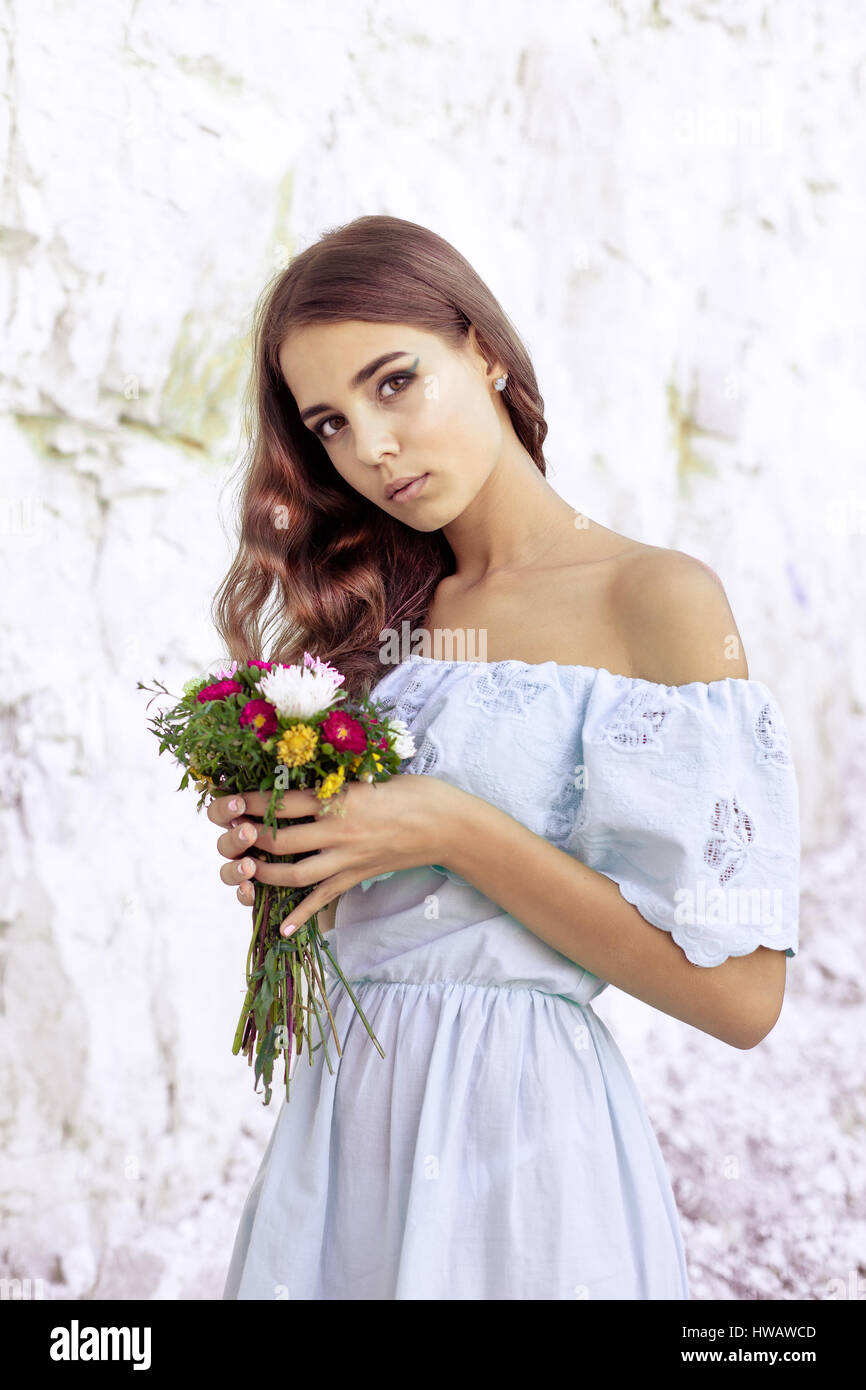 Beautiful girl with flowers Stock Photo - Alamy