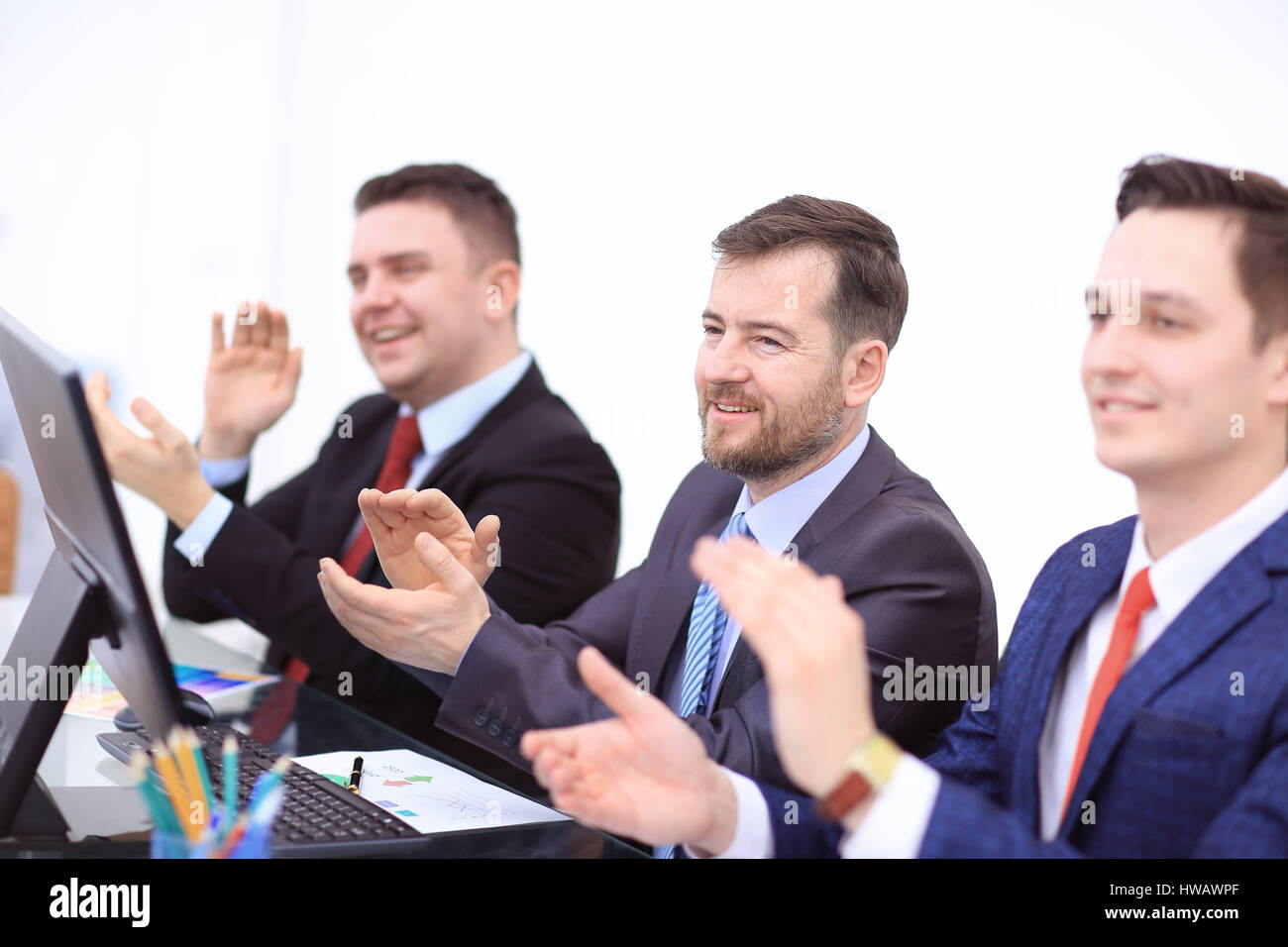 Business team laptop clapping hands hi-res stock photography and images ...
