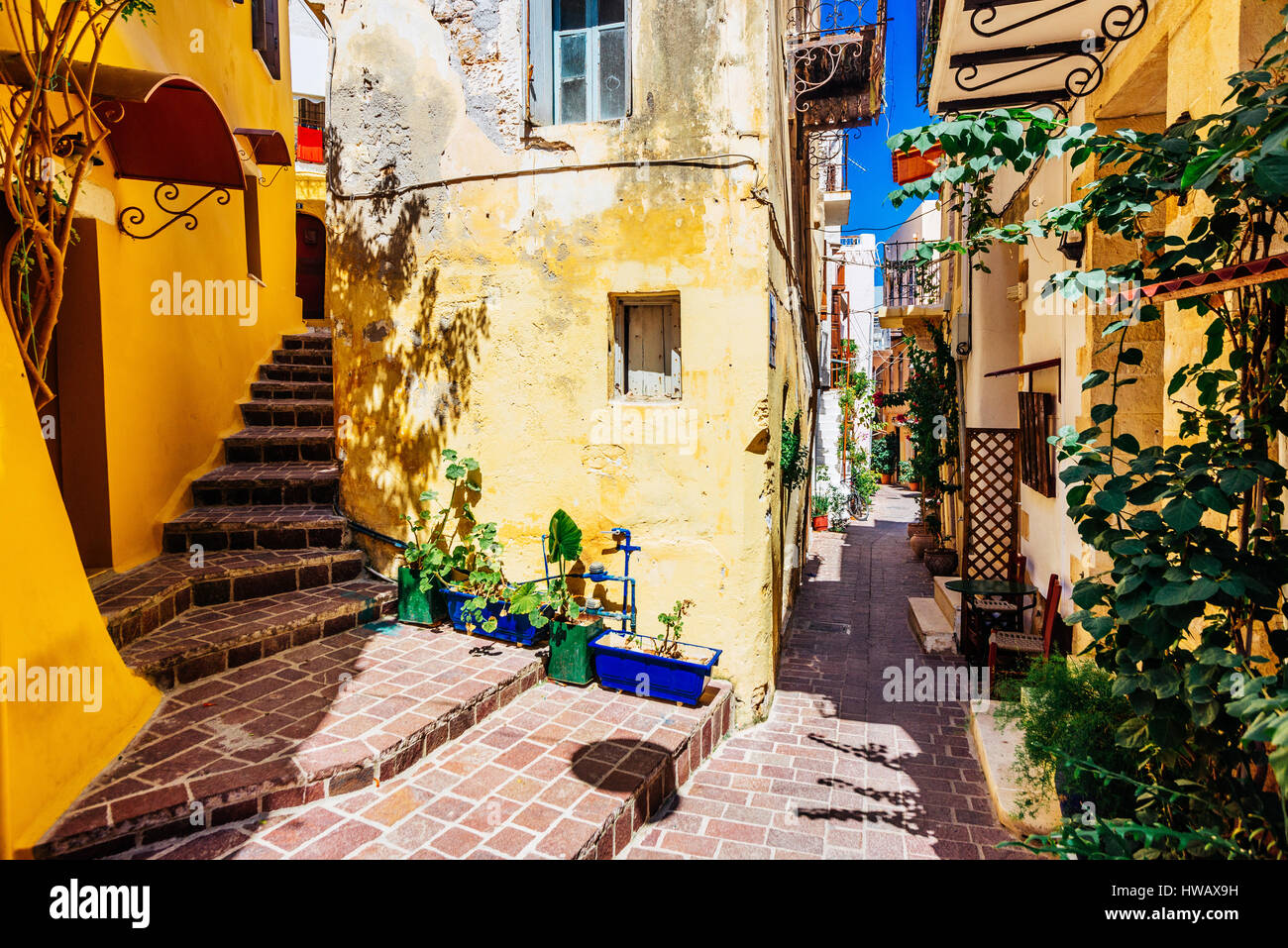 Authentic narrow colorful mediterranean street in Cretan town of Chania ...