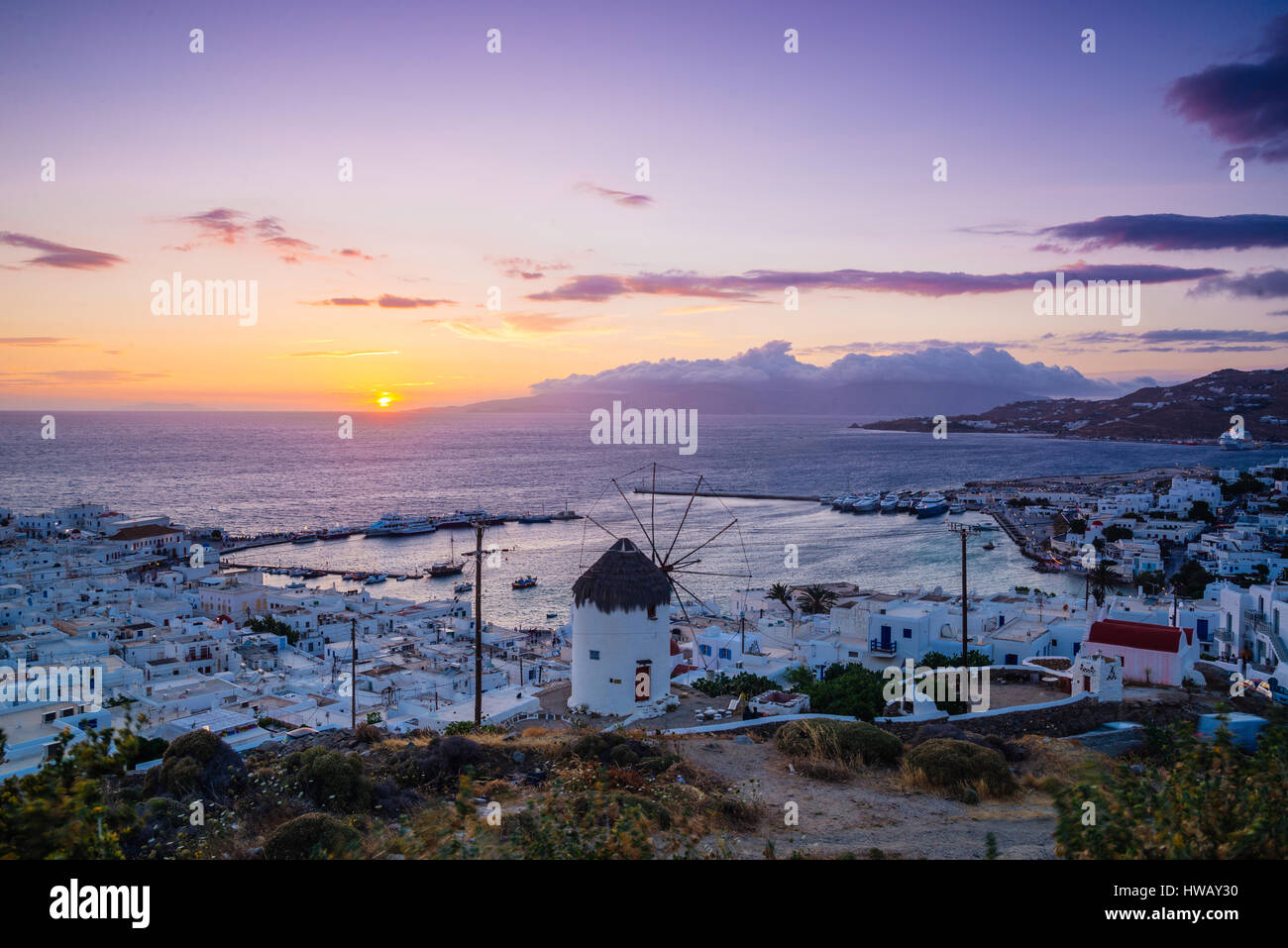 Sunset at famous Mykonos windmill, Mykonos island, Cyclades archipelago ...