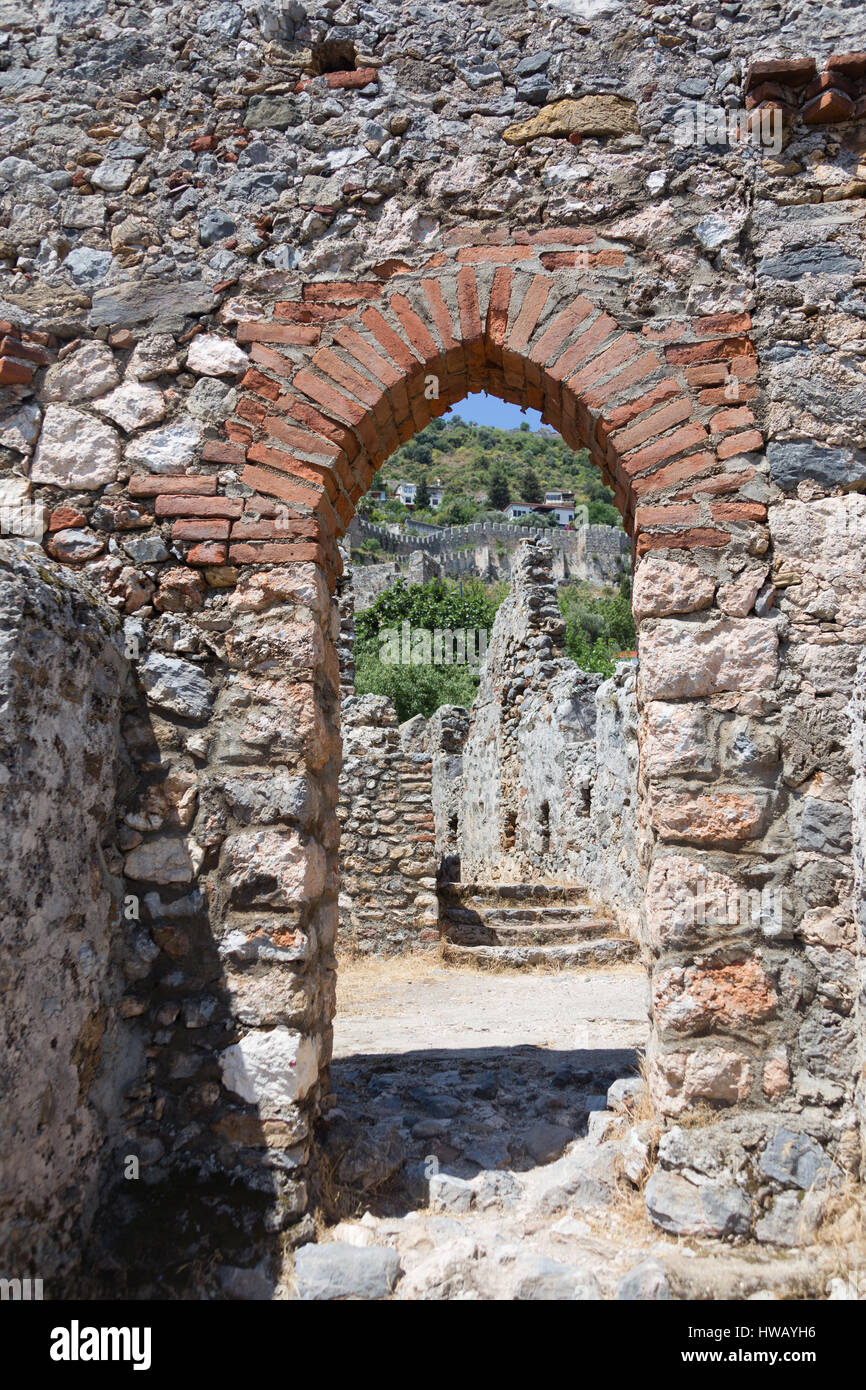 Potrait layout of medieval castle wall of Alanya with arch from which ...