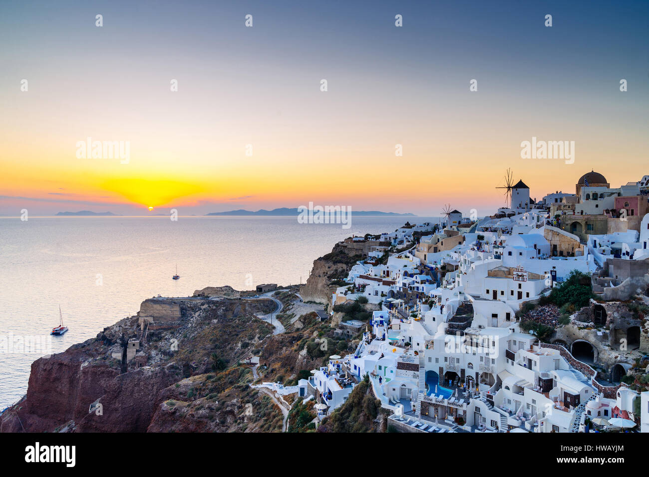 Oia village on Santorini island at sunset, Greece Stock Photo - Alamy