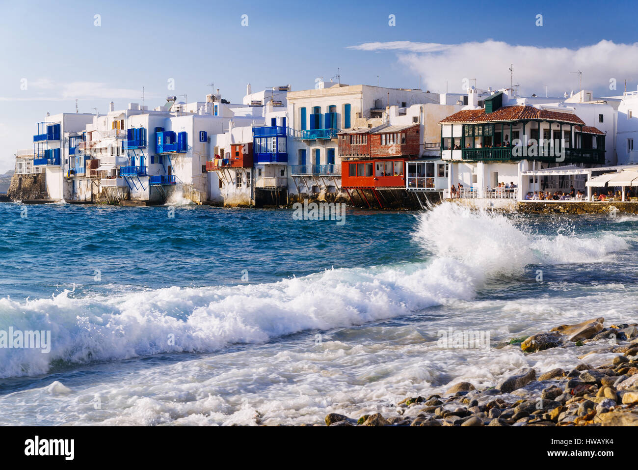 Mykonos Little Venice quarter on a windy summer afternoon with breaking ...