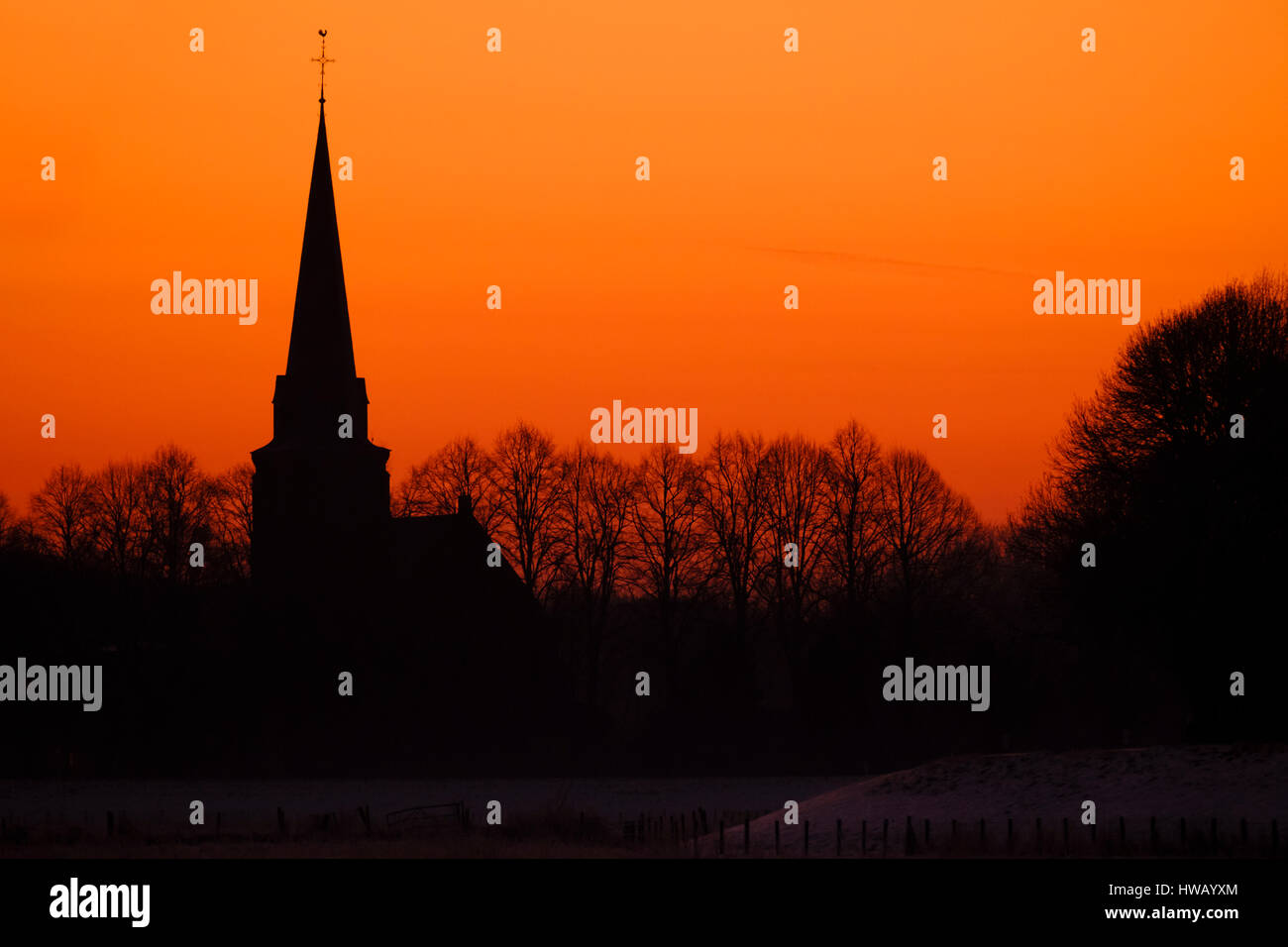 Beautiful sunset with a silhouette of a church Stock Photo - Alamy