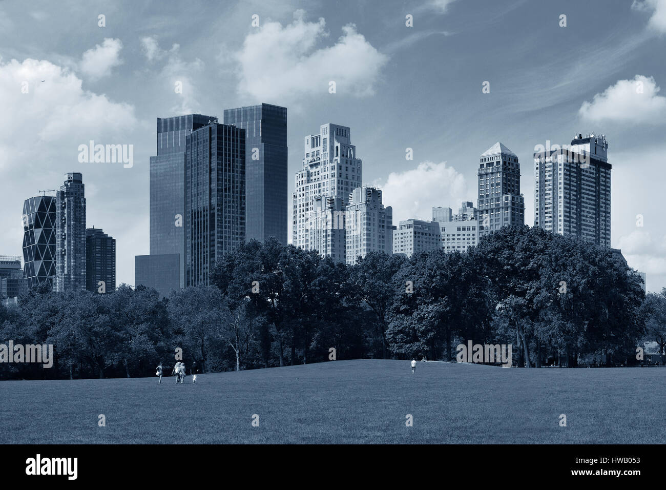 Central Park Spring with skyline in midtown Manhattan New York City ...