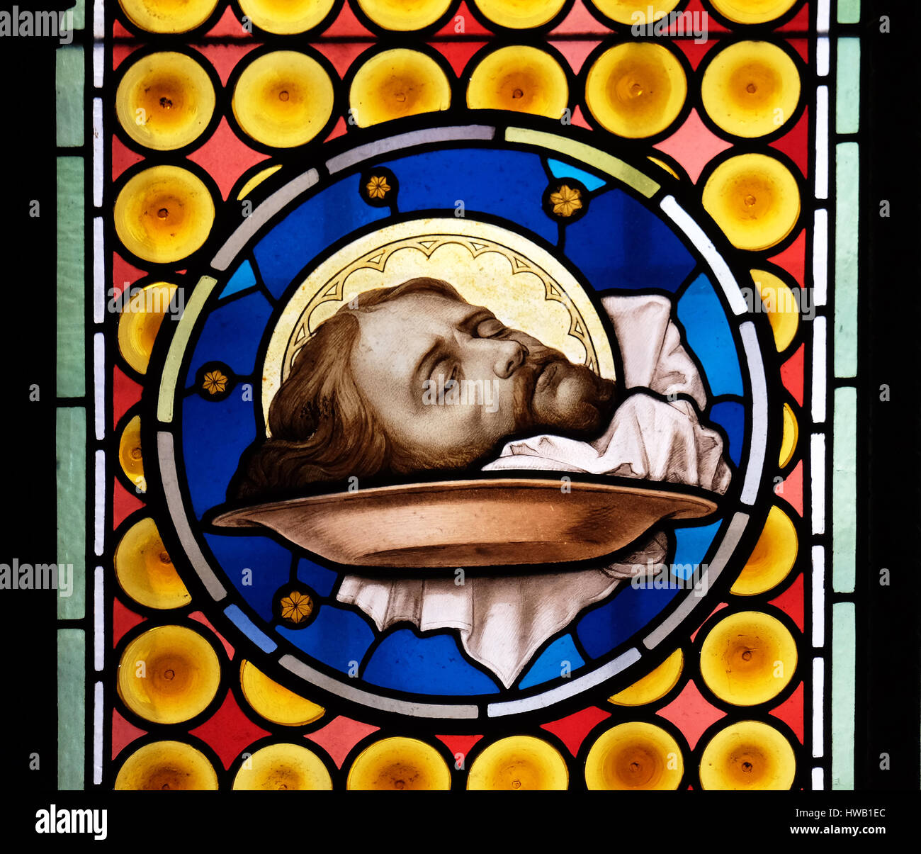 The head of Saint John the Baptist, stained glass window in Basilica of ...