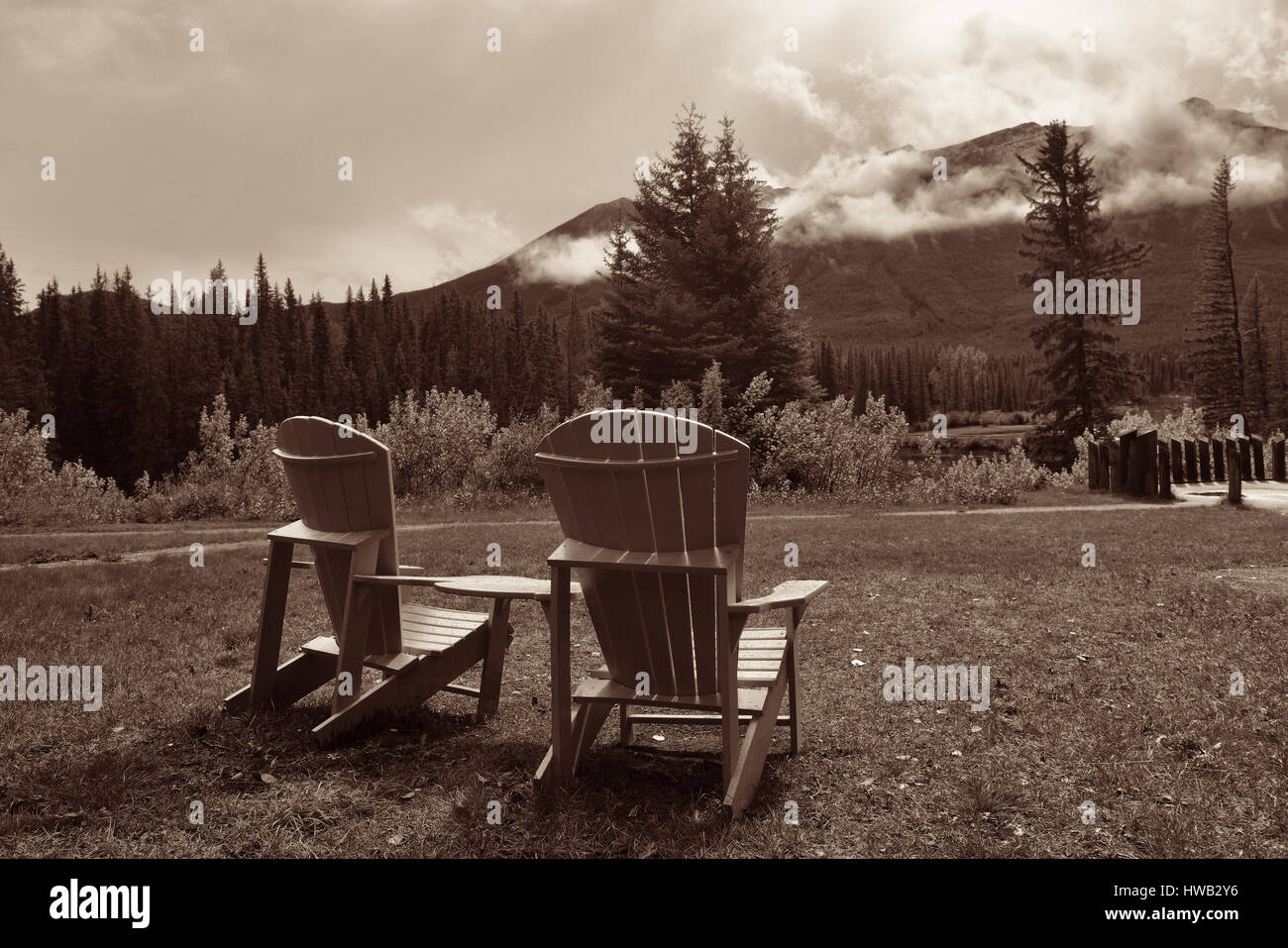 Banff national park with chairs andfoggy mountains and forest in Canada ...