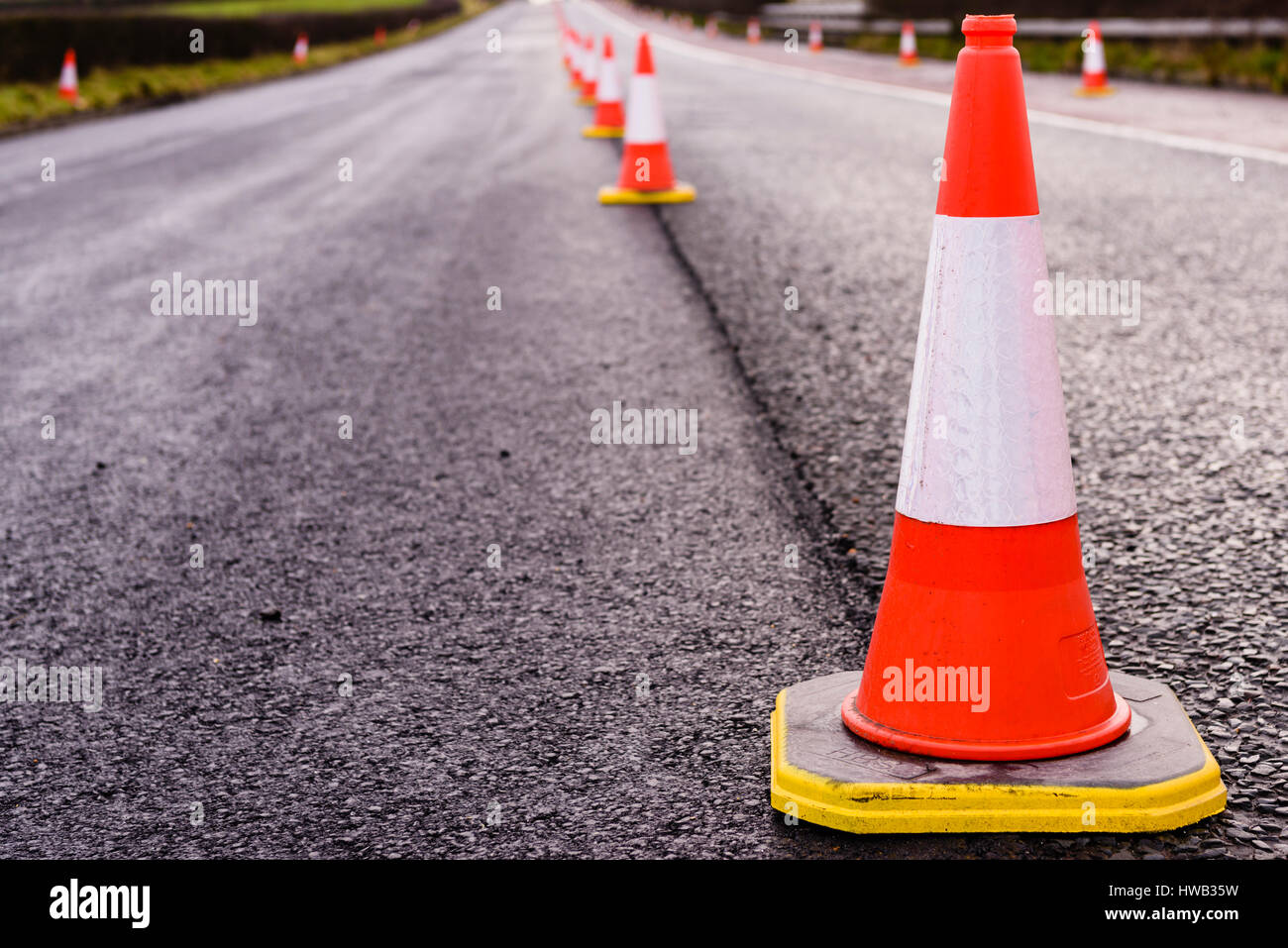Row of traffic cones along the middle of a road being resurfaced Stock ...