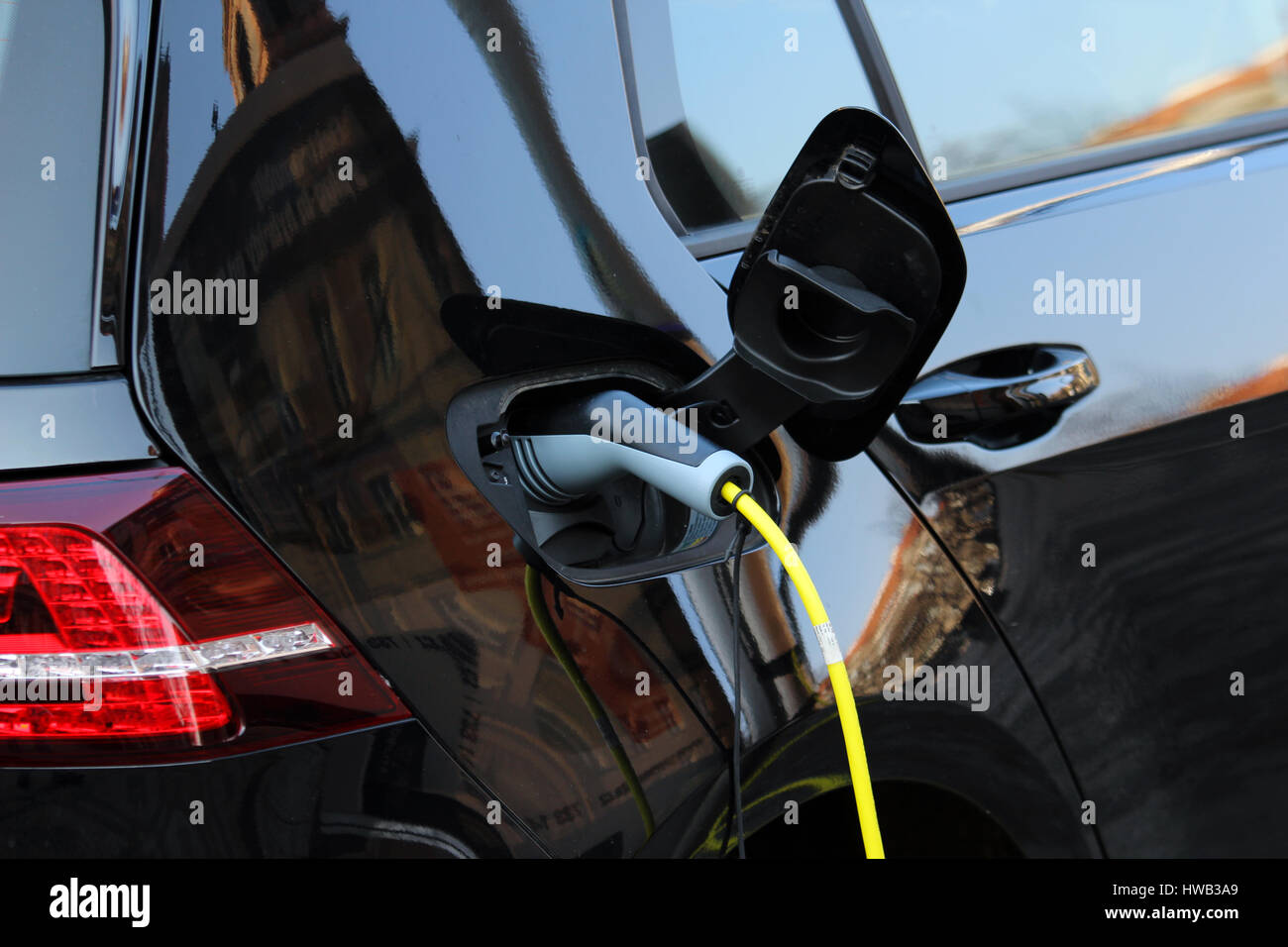 hybrid car charging power on the street Stock Photo - Alamy