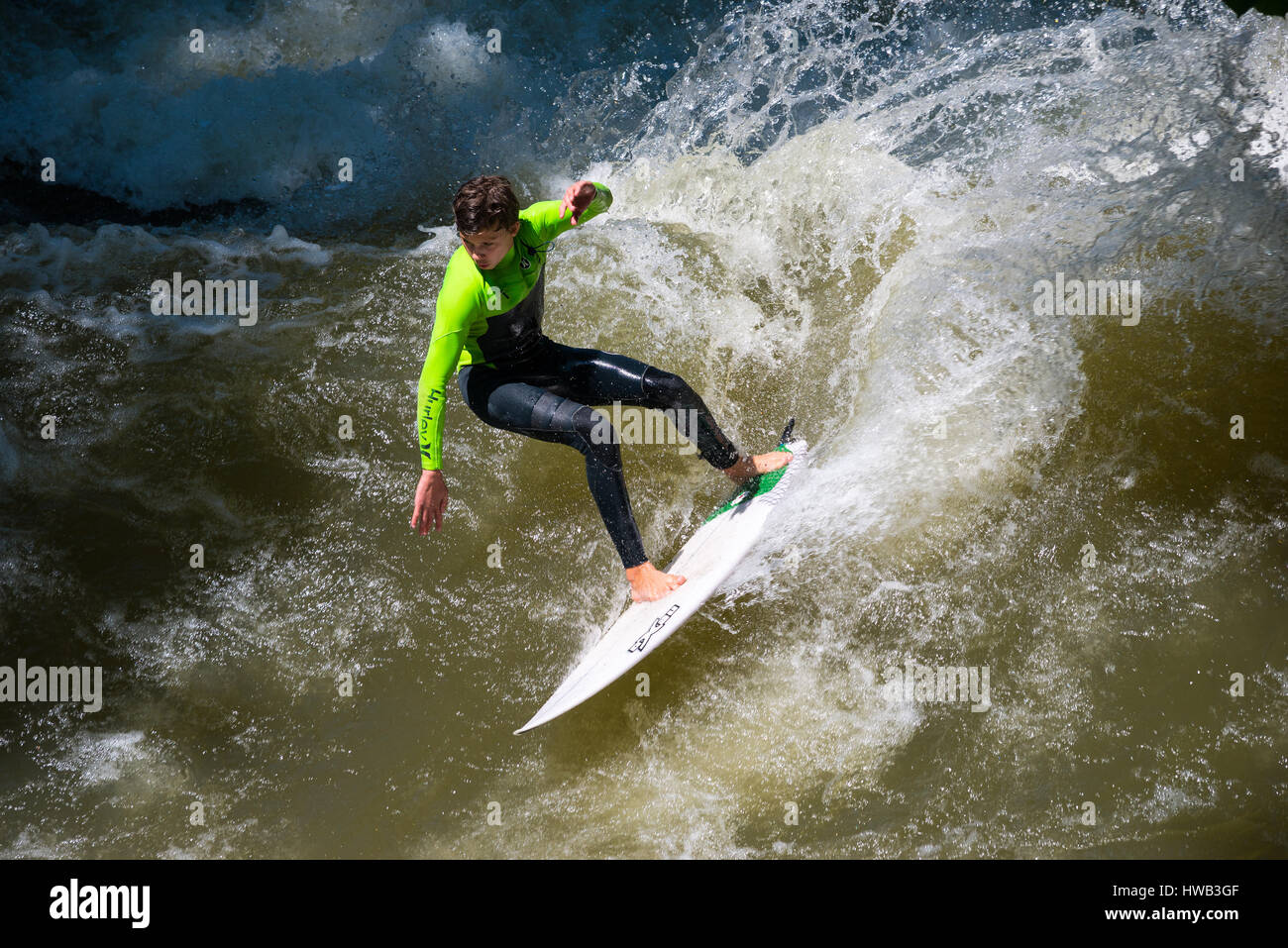 Munich, Germany - June 7, 2016: Boarders surfing on the Isar river in ...